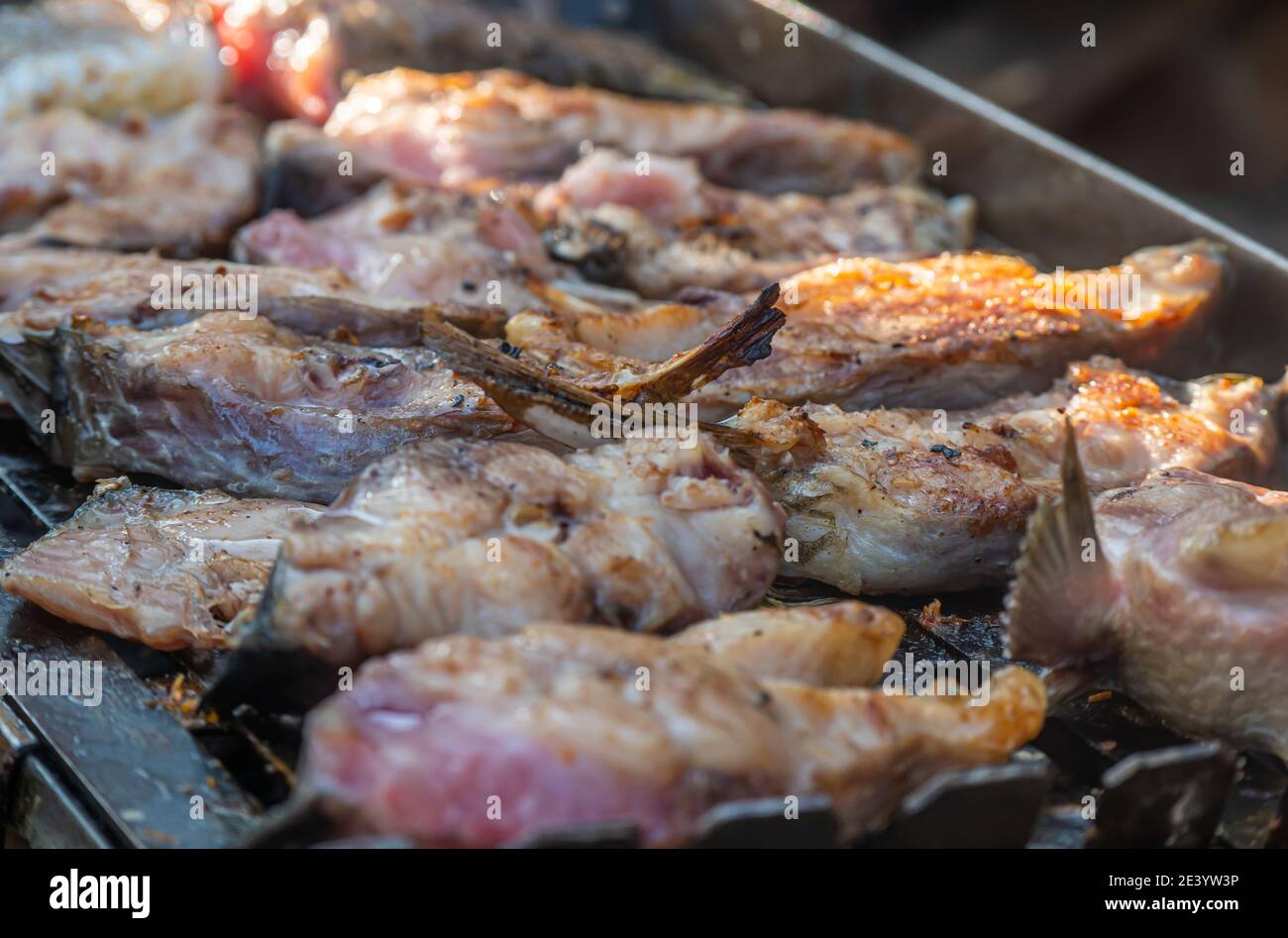 fish on the grilled roast cooking outdoor Stock Photo - Alamy