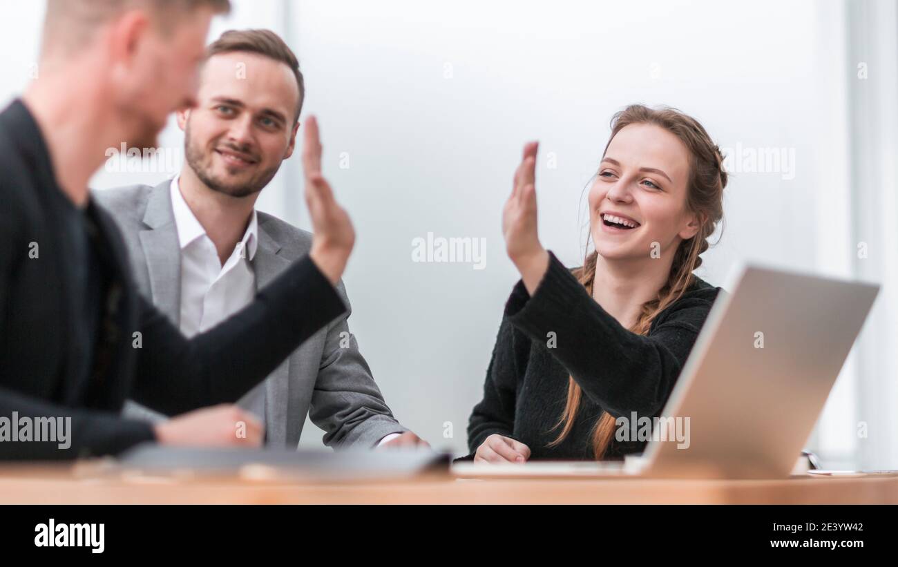 confident business colleagues giving each other a high five Stock Photo ...