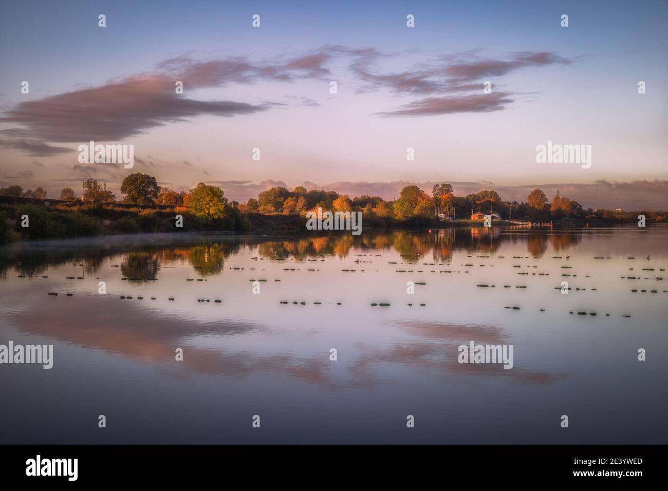 Beautiful sunrise light and reflections on Shustoke Reservoir in ...