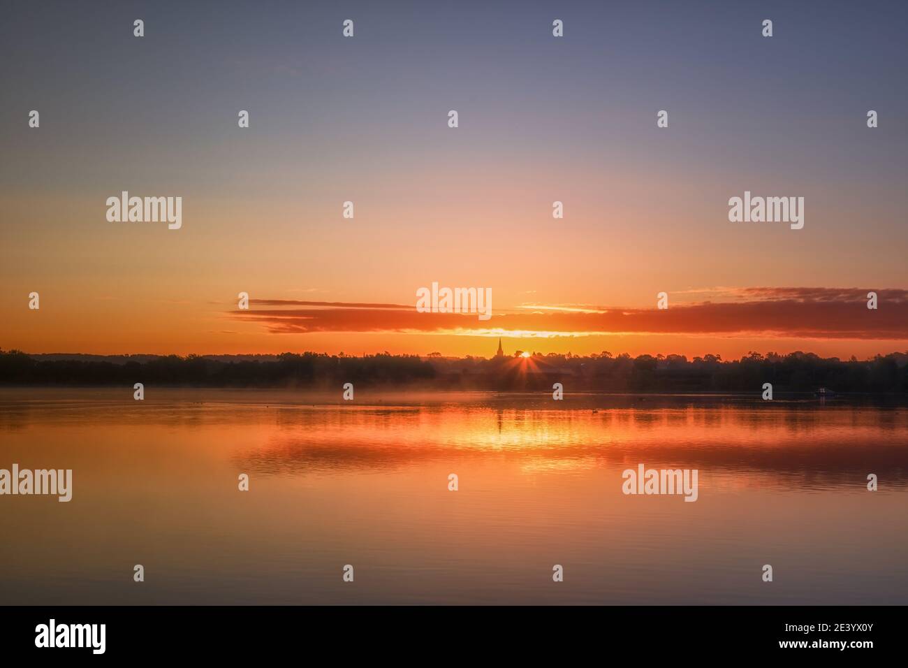 Beautiful sunrise light and reflections on Shustoke Reservoir in ...