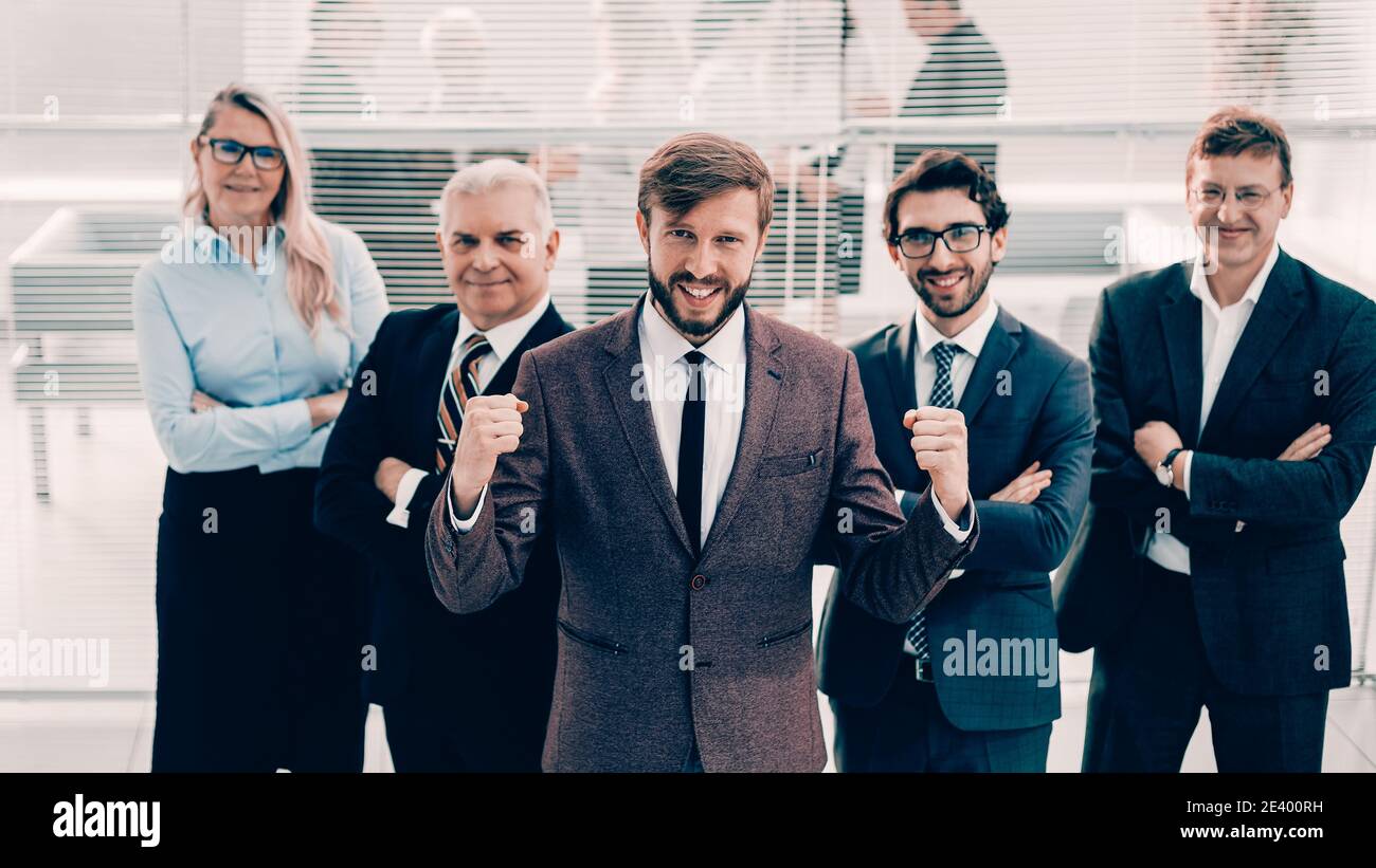 emotional happy boss standing in front of his team Stock Photo - Alamy