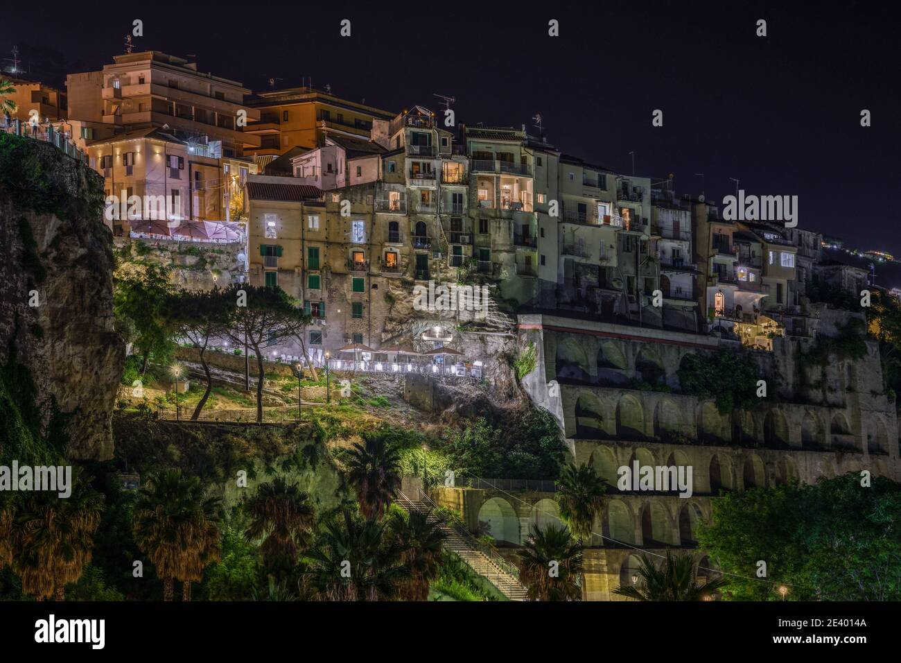Scenic night view with illuminated buildings built on the cliffs in ...