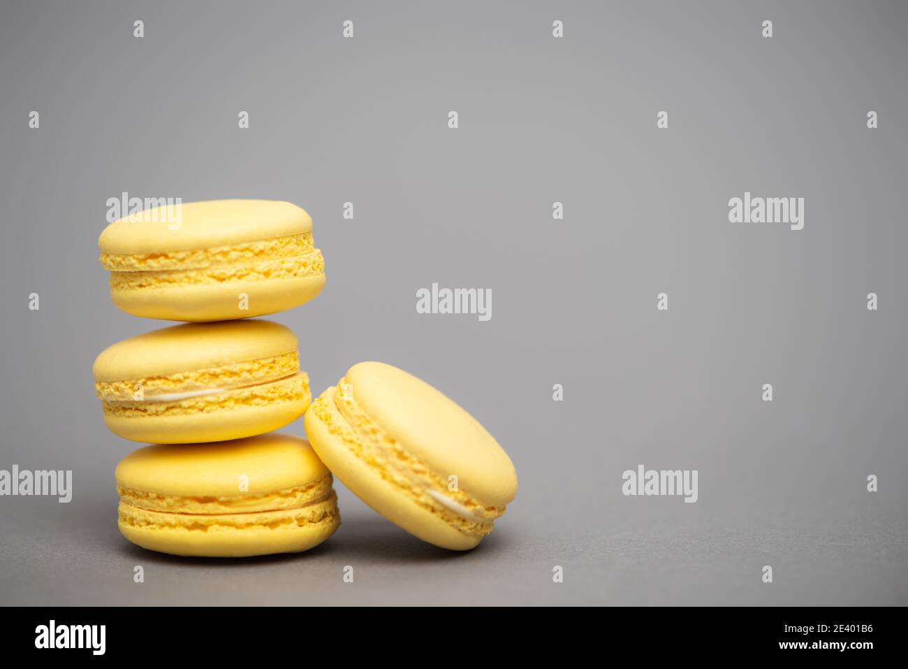 delicious yellow macarons on grey background Stock Photo - Alamy