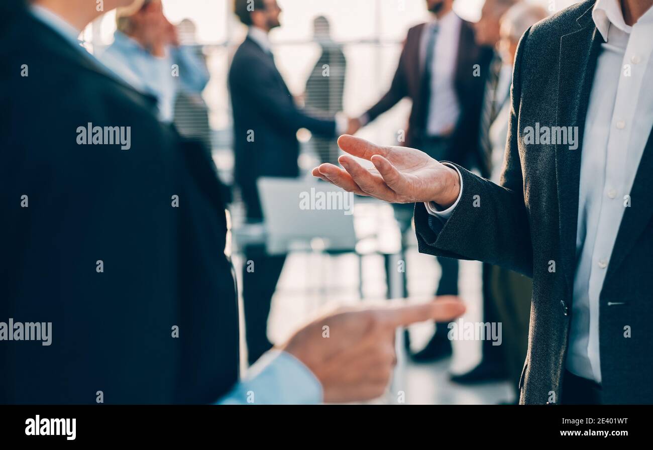 close up. business colleagues discussing current tasks standing Stock ...