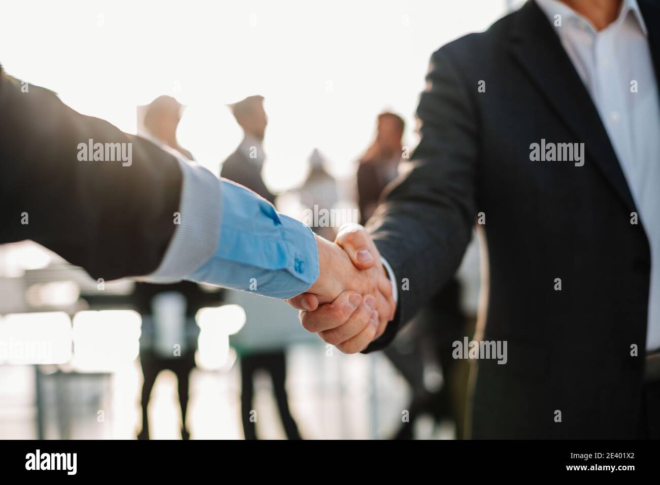 close up. strong handshake of business people on the office background ...