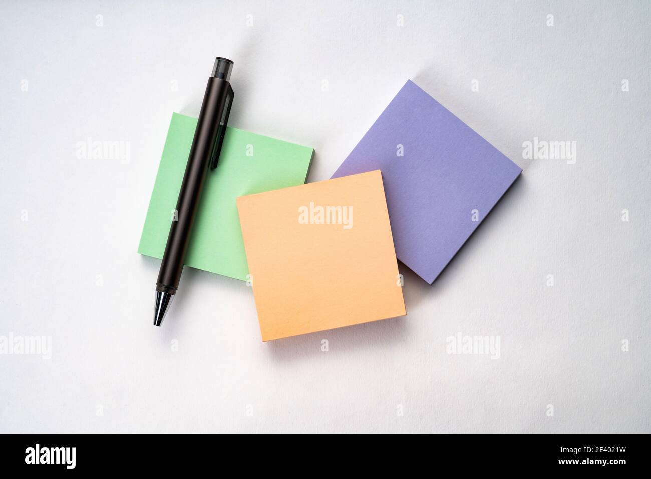 Topview of sticky note and pen on white surface Stock Photo - Alamy
