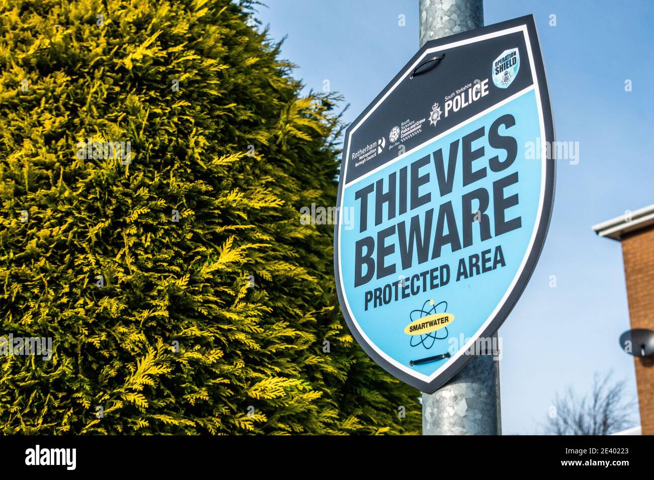 Police thieves beware blue sign in the shape of a shield Stock Photo ...