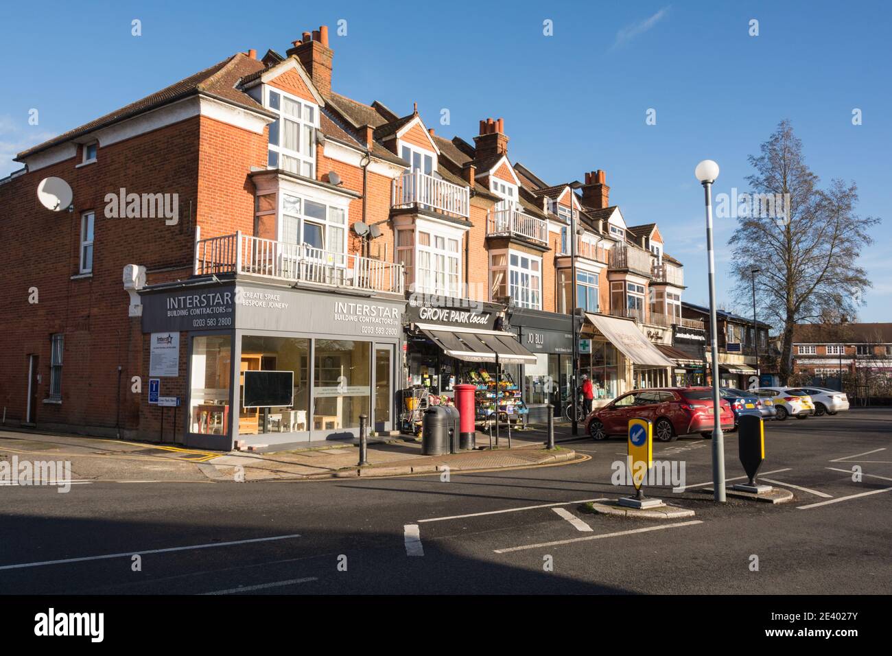 A parade of shops on Grove Park Road, Chiswick, London, W4, England, U ...