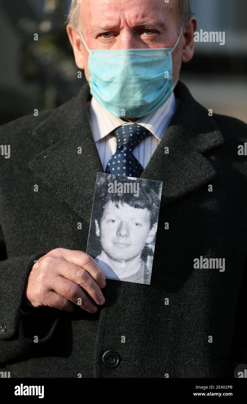 Michael McElhone holds a photograph of his late brother Paddy McElhone ...