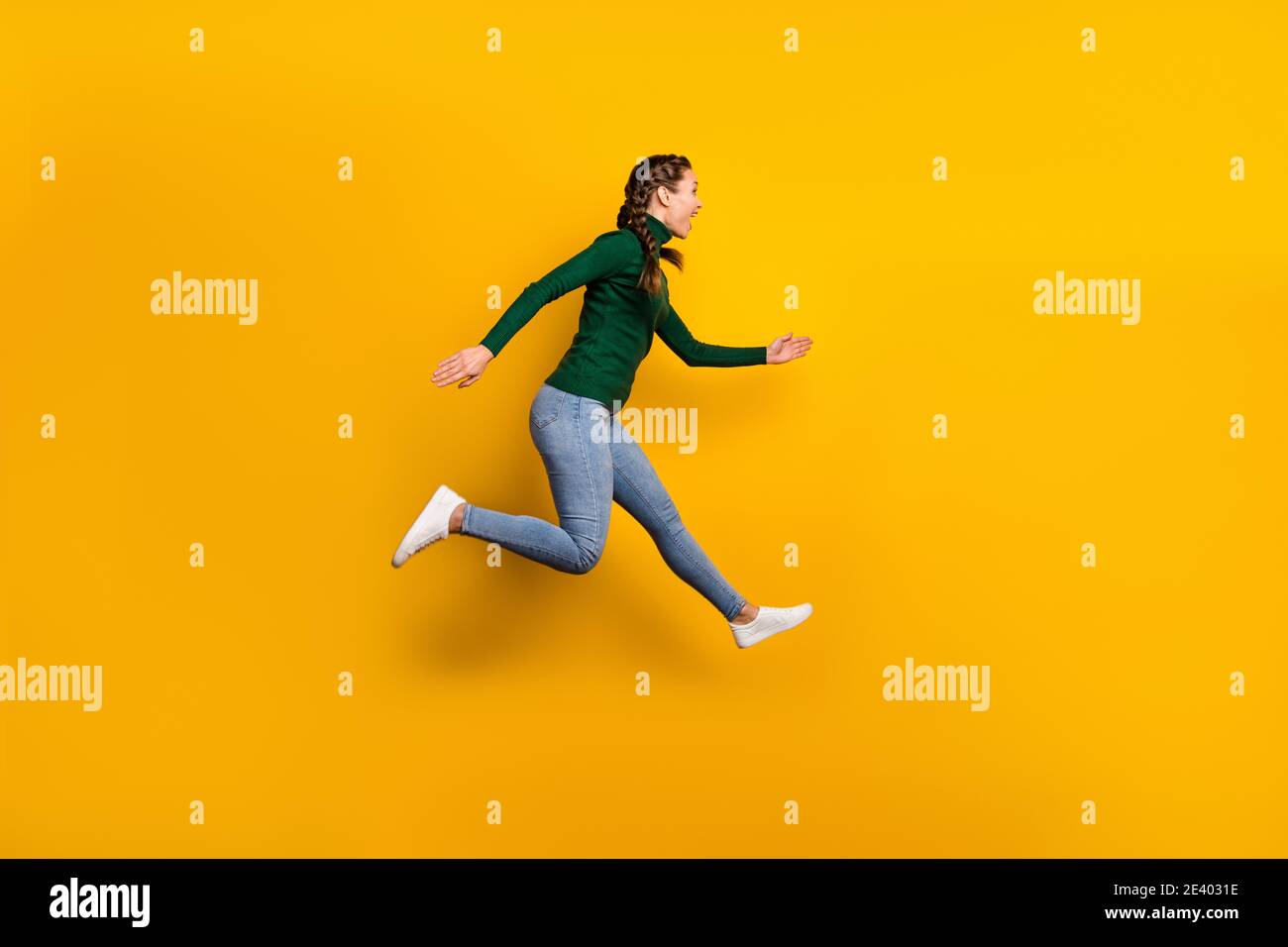 Full length body size view of pretty cheerful girl jumping running fast ...