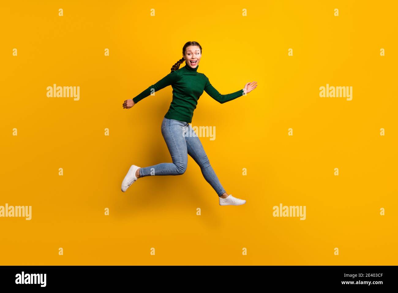 Full length body size view of lovely slim cheerful girl jumping running ...