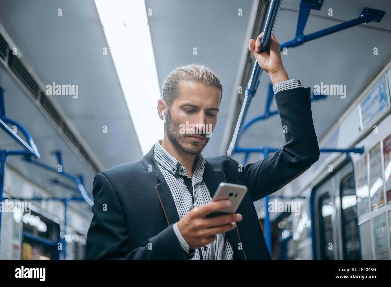 business man checking his email correspondence in the subway Stock ...