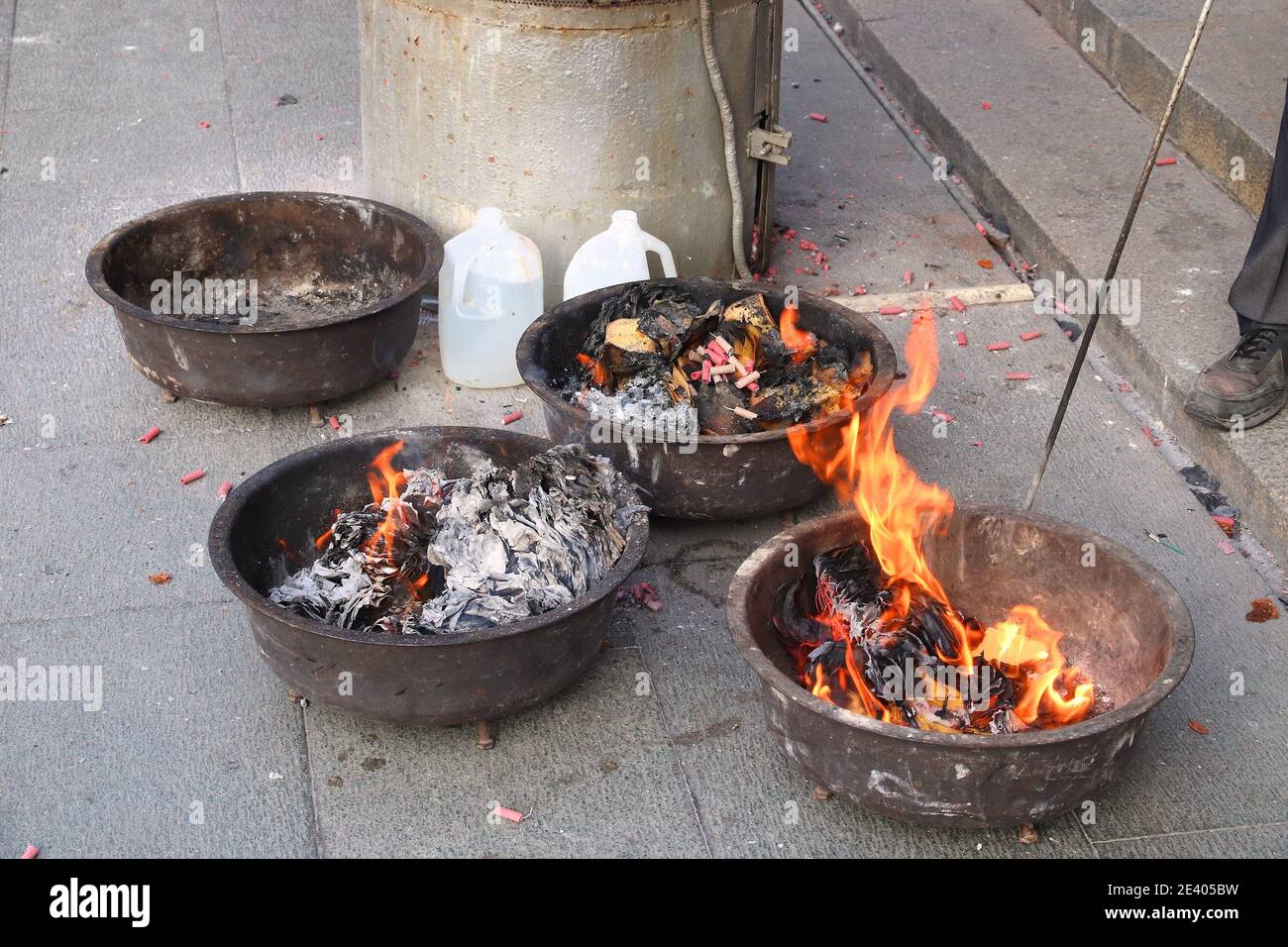 Chinese ancestral worship tradition. Burning joss money (ghost money ...