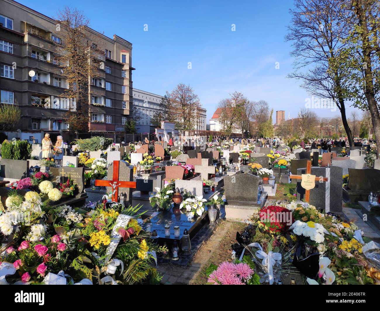 CHORZOW, POLAND - NOVEMBER 1, 2019: People visit graves during All ...