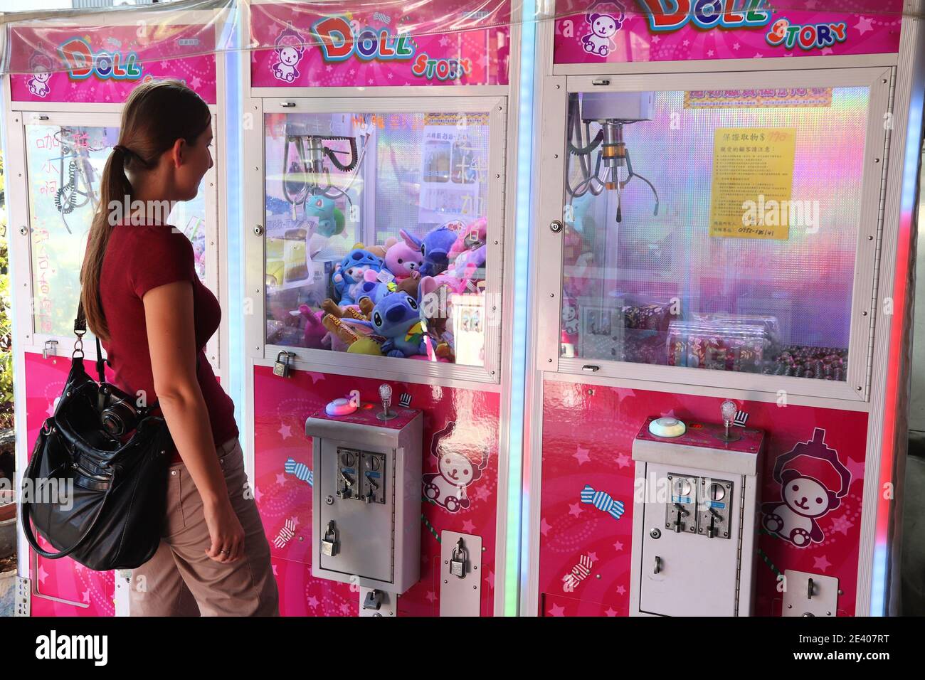 LUKANG, TAIWAN - DECEMBER 2, 2018: Person visits toy claw machine ...