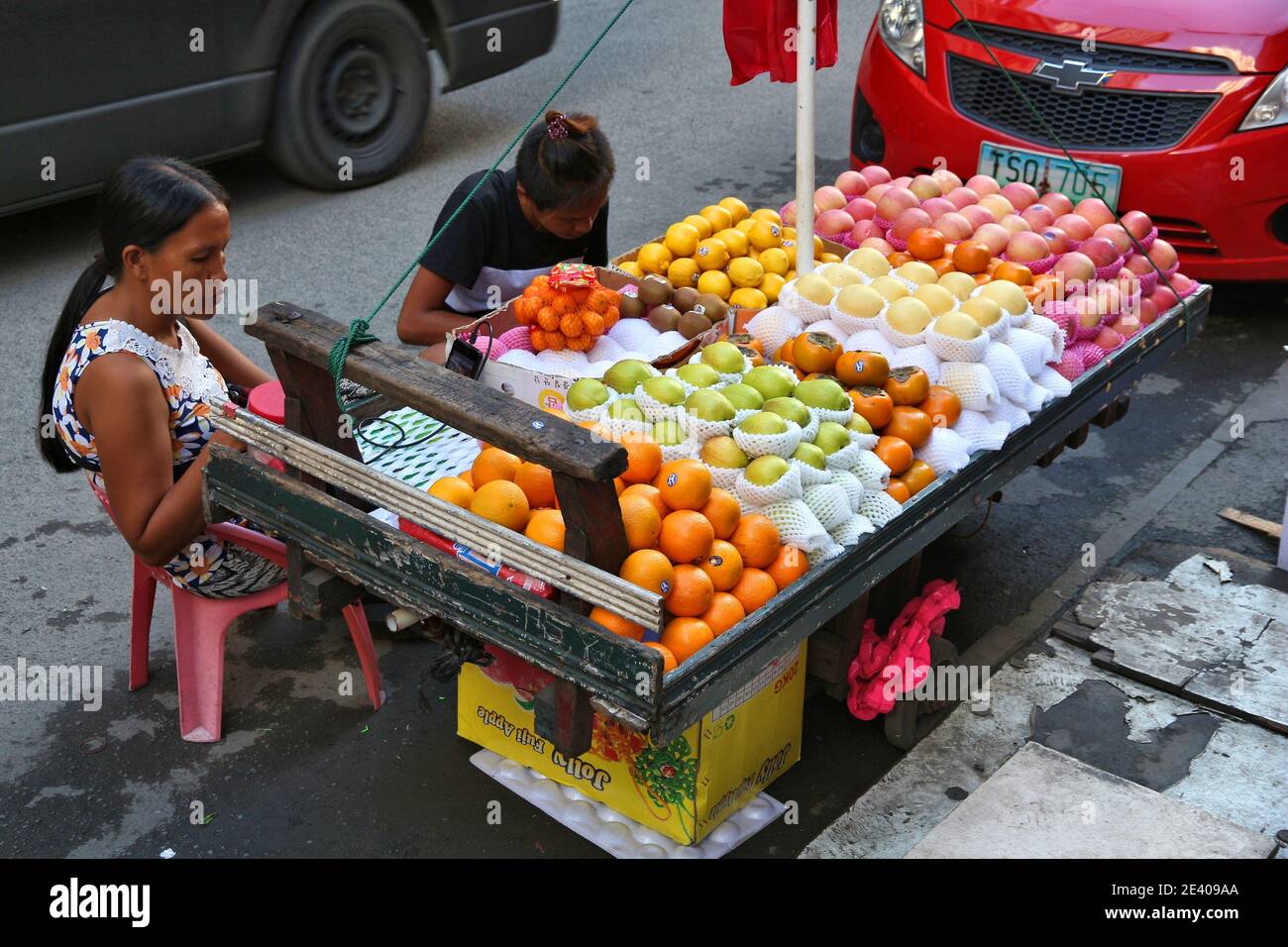 MANILA, PHILIPPINES - NOVEMBER 25, 2017: Vendors sell fruit in Binondo district in Manila ...