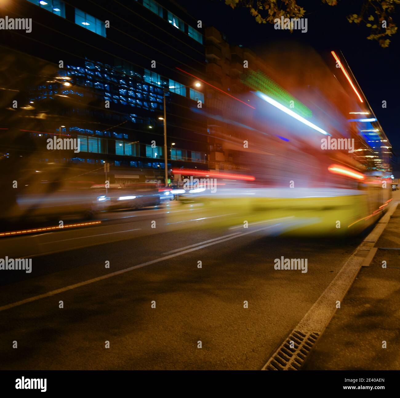 Driving bus in city traffic in motion blur Stock Photo - Alamy