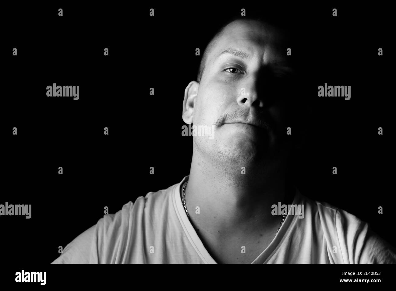 Close-up black and white portrait of a strong, confident male person ...