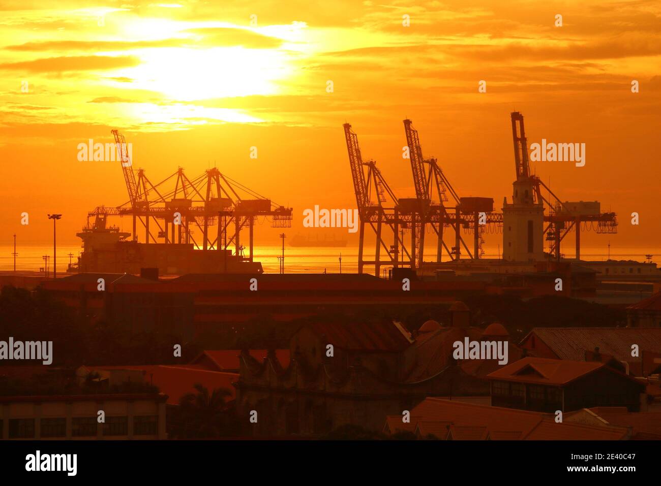 Port of Manila, Philippines. Seaport loading cranes in sunset light ...