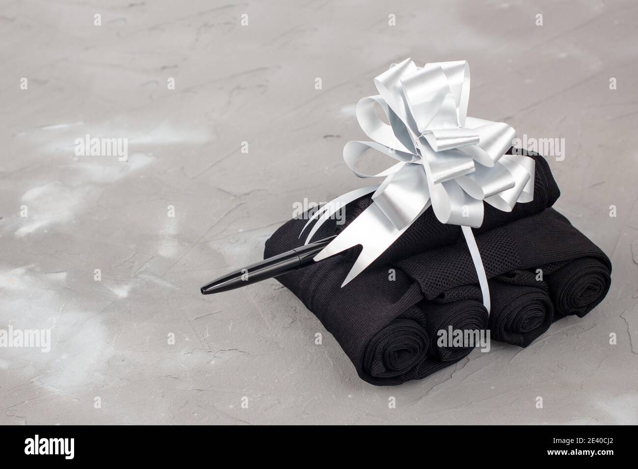 Handmade tanks of socks as gift to men on February 23 on grey ...