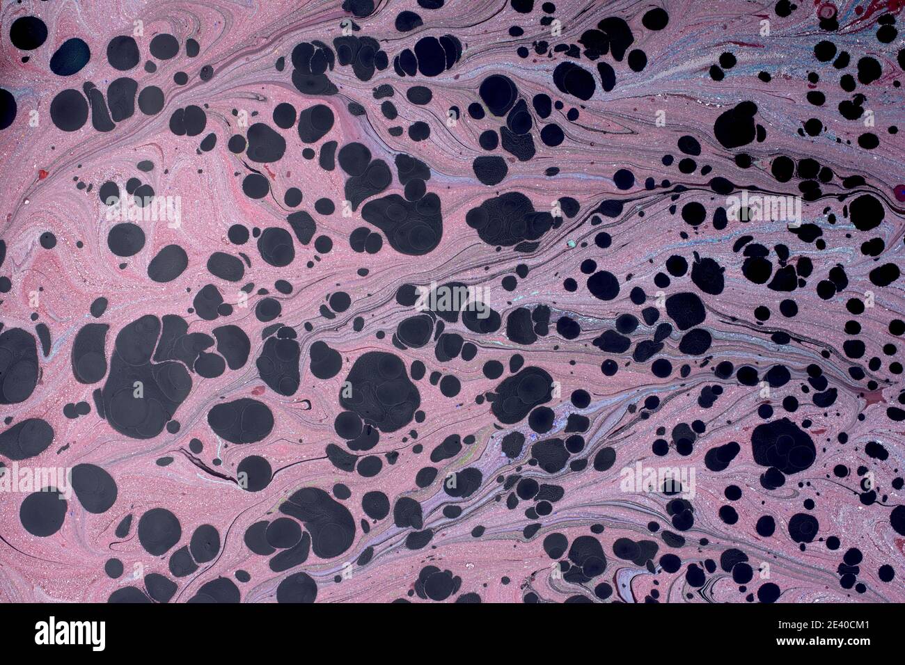 Texture of paper marbling design pattern in dark gray and pink colors ...