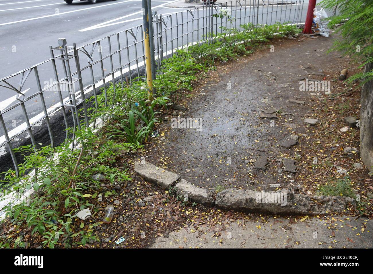 Dangerous uneven city sidewalk in Manila, Philippines. Hazardous holes ...