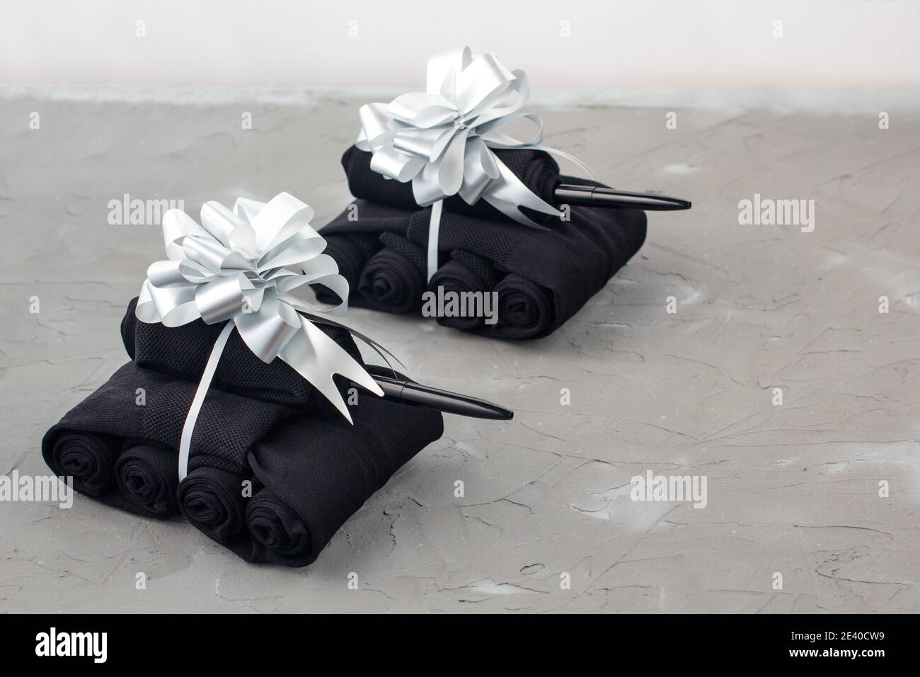 Handmade tanks of socks as gift to men on February 23 on grey ...