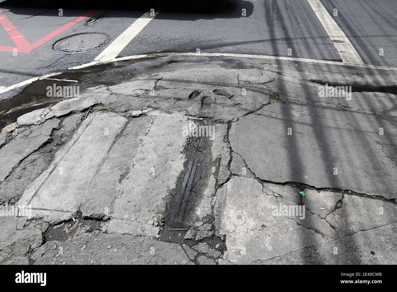Dangerous city sidewalk in Manila, Philippines. Hazardous holes and ...