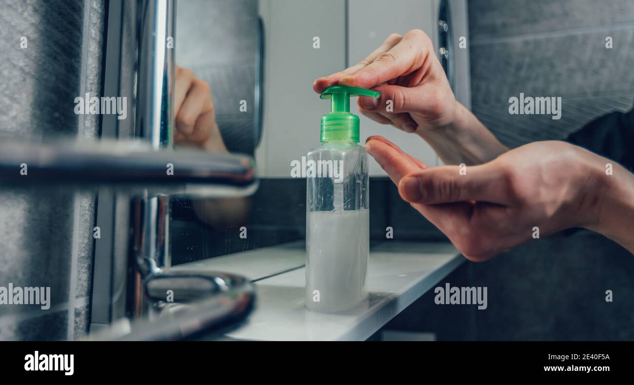 close up. man pressing the dispenser with bactericidal soap Stock Photo ...