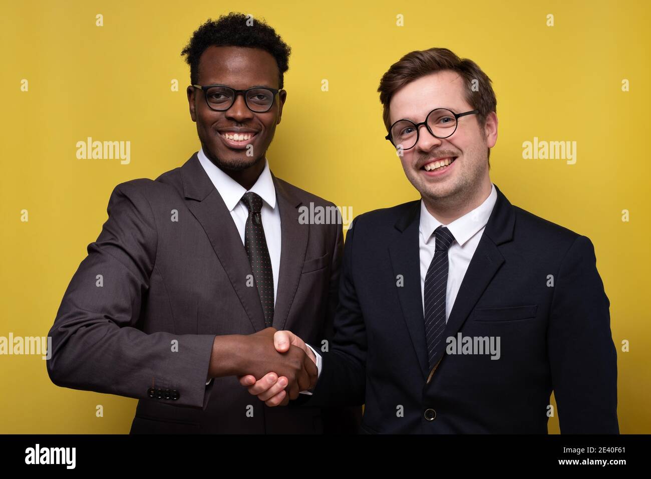 Handshake of two business people. Two men making a deal. Studio shot on ...