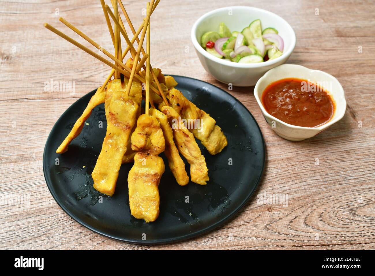pork satay with sweet peanut sauce and pickled vegetable cup Stock ...