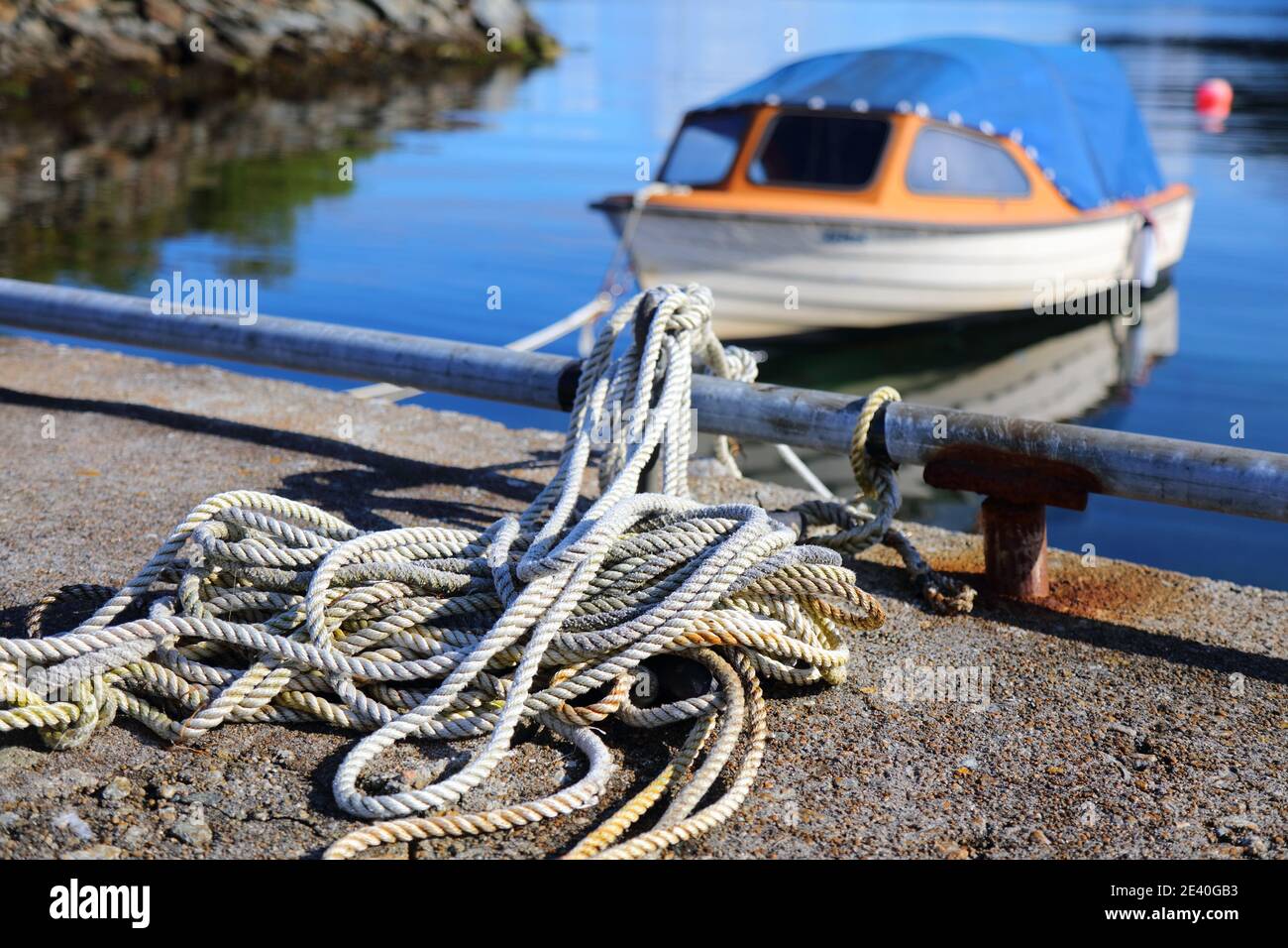 Norway coast in summer. Fishing harbor rope at Karmoy island Stock ...