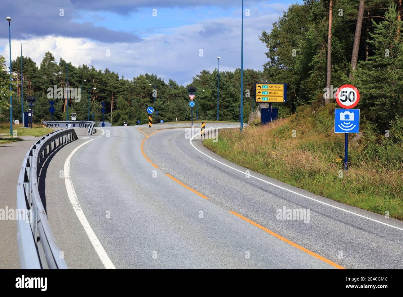 Road and roundabout in Vestland region, Norway. 50 kmh speed limit and ...
