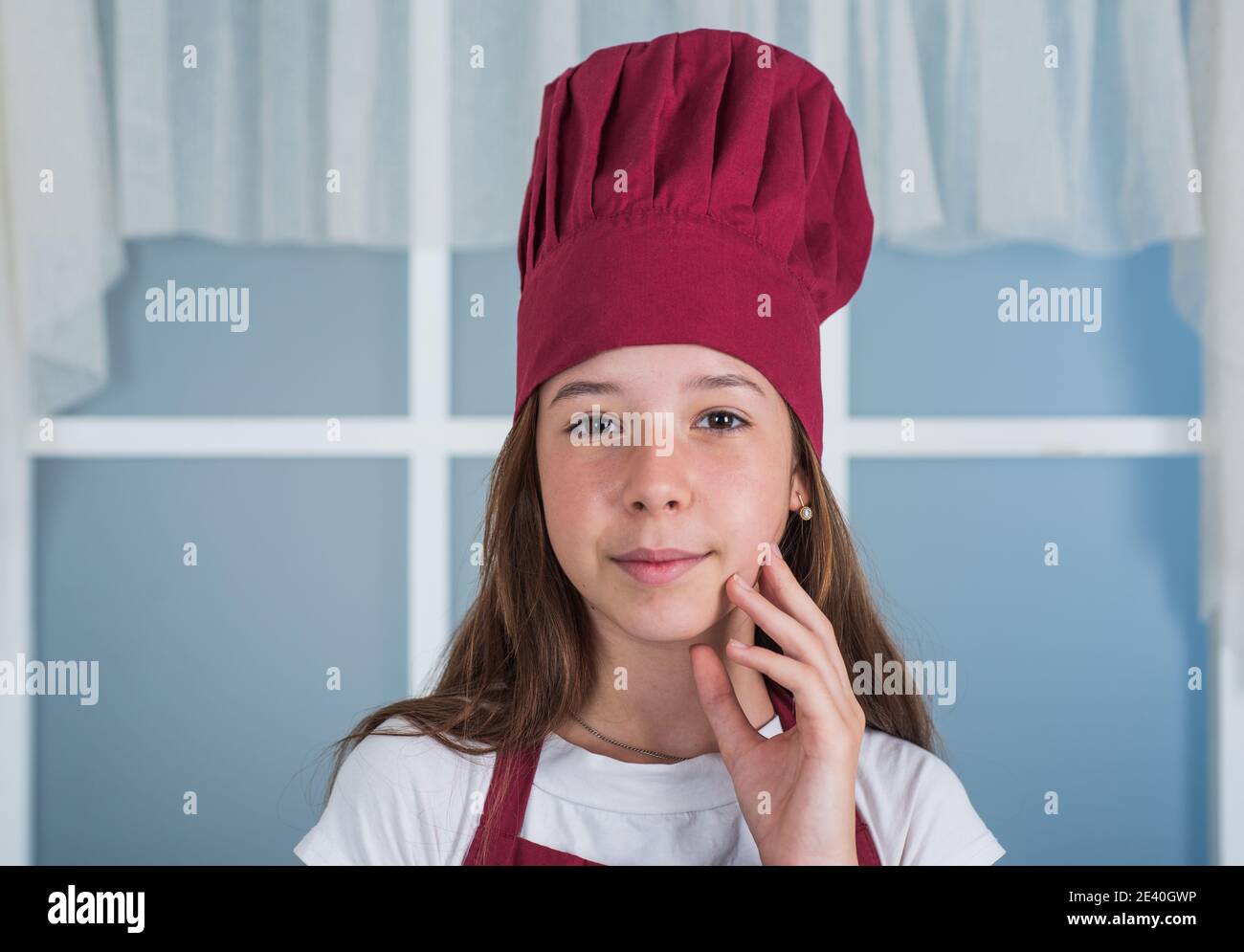 teen girl chef wearing uniform. child study how to cook by recipe. kid ...