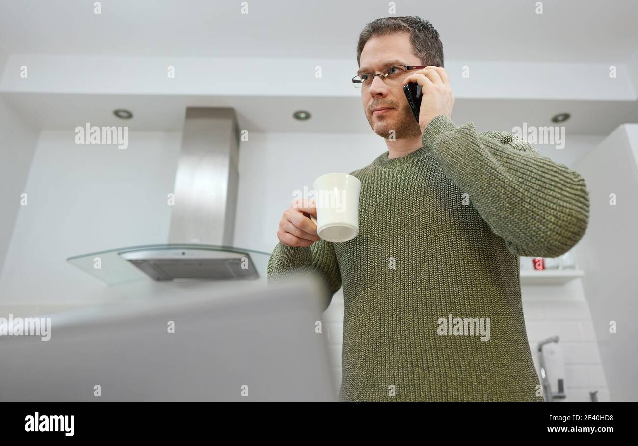Man calling by mobile phone .Self isolation at home Stock Photo - Alamy