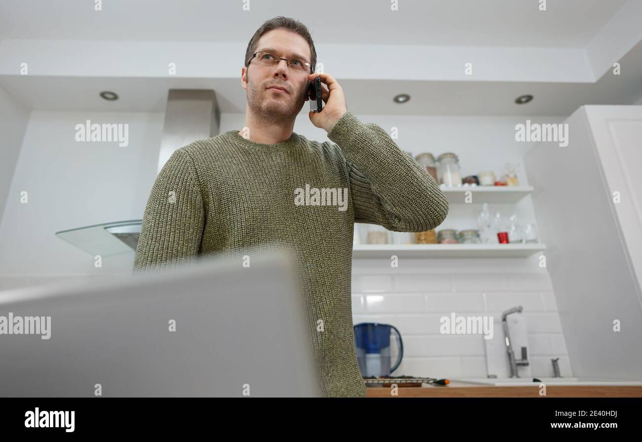 Man calling by mobile phone .Self isolation at home Stock Photo - Alamy