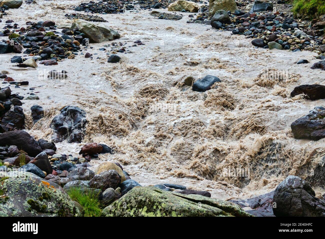 A powerful stream of water is squeezed between the sides of the rocks ...