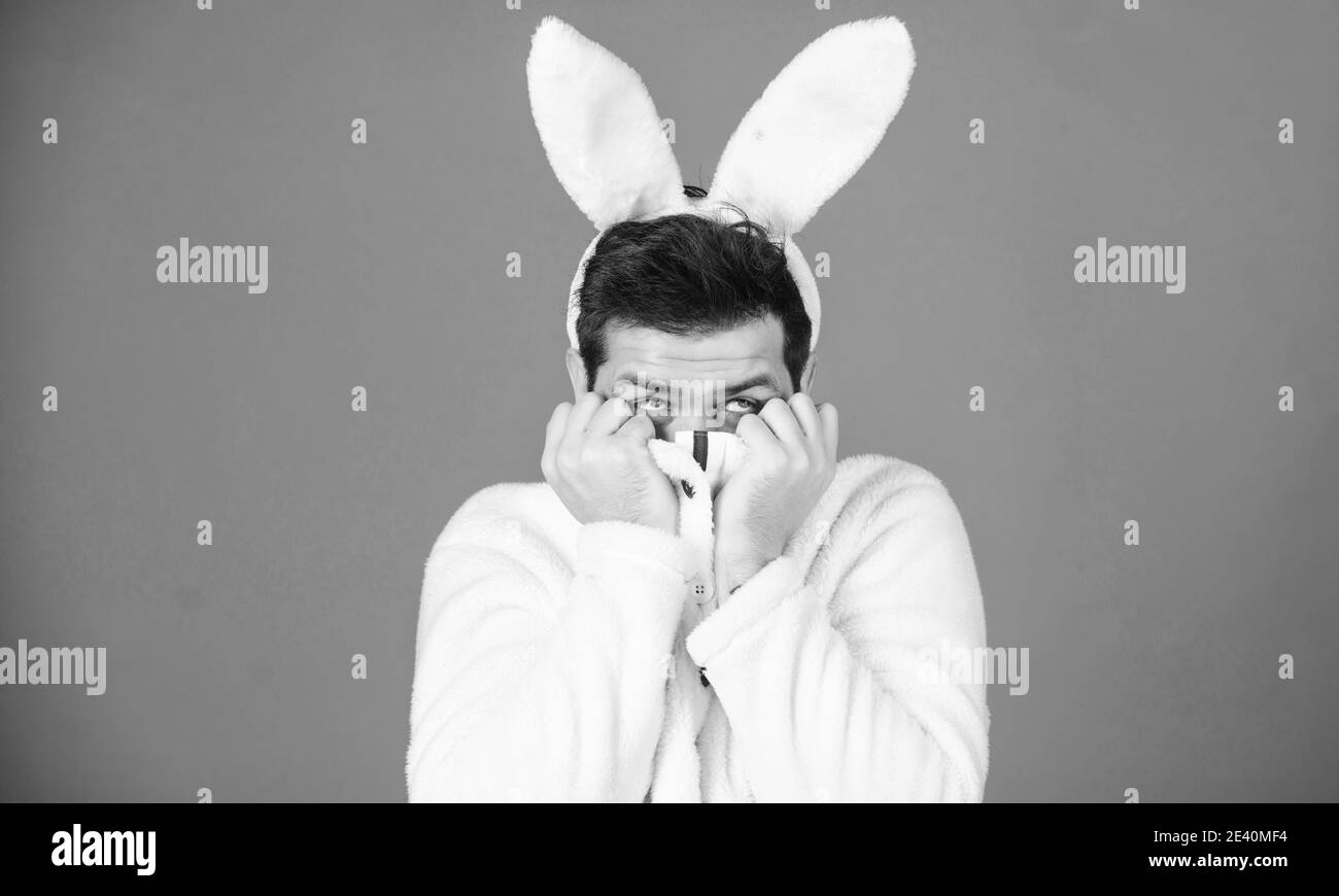 Soft and tender. Guy with long bunny or rabbit ears on violet ...