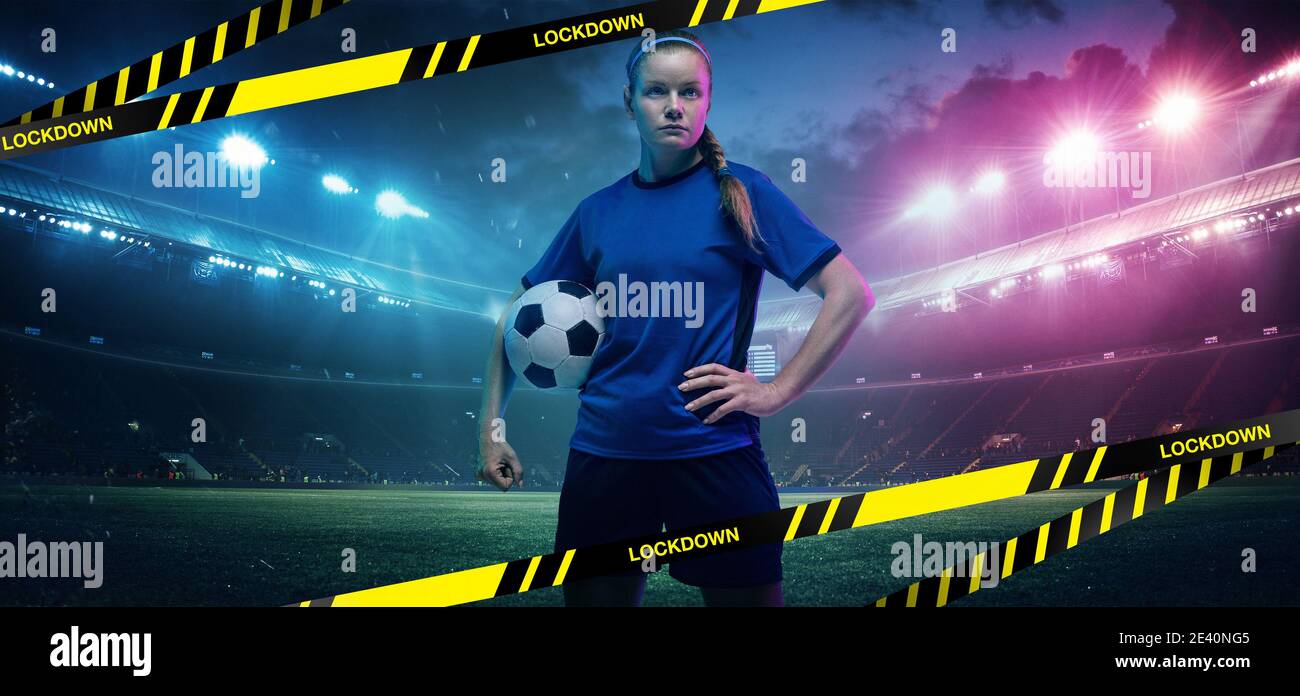 Football or soccer player on stadium background behind limiting tapes ...