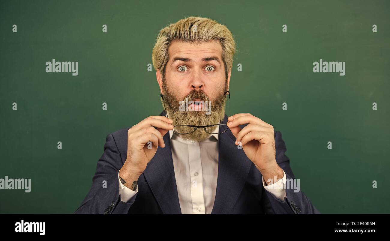 Being open to surprise in classroom. Surprised teacher green chalkboard ...