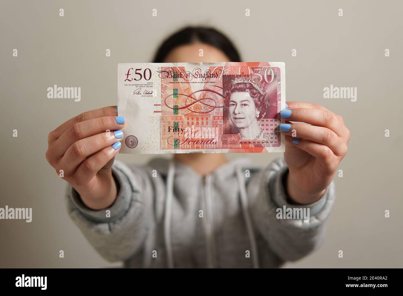 50 pound notes holding hi-res stock photography and images - Alamy
