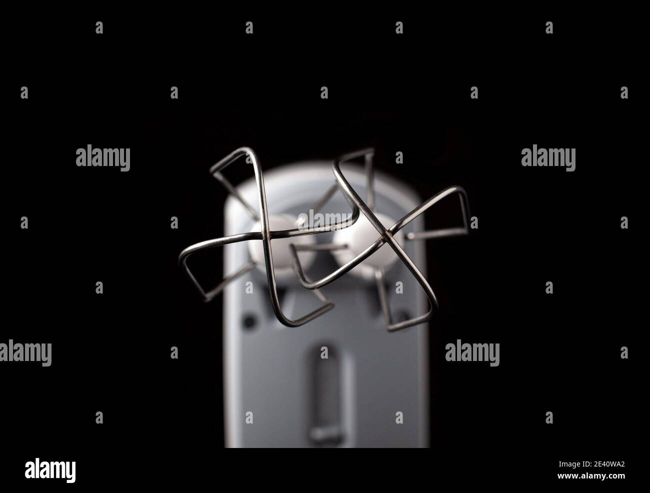 Bottom view on stirring whisks of hand mixer wih narrow DOF, focused on ...