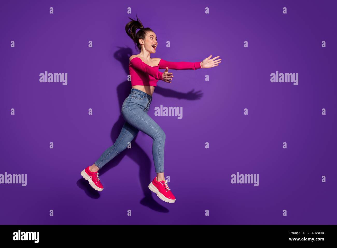 Full length body size view of kind slim cheerful girl jumping running ...