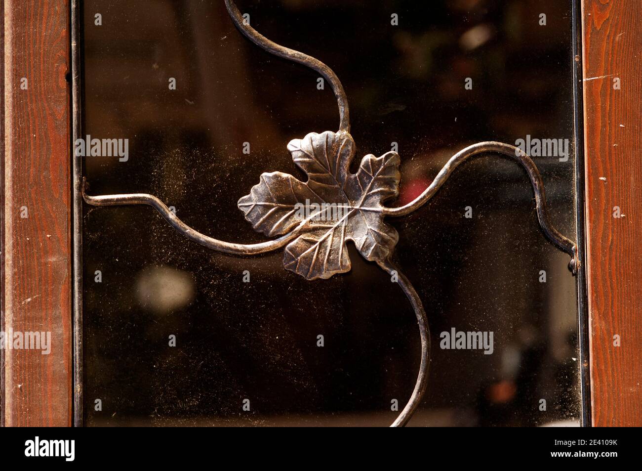 Detail of a metal vine leaf over a dusty window, Hvar, Dalmatian Coast ...