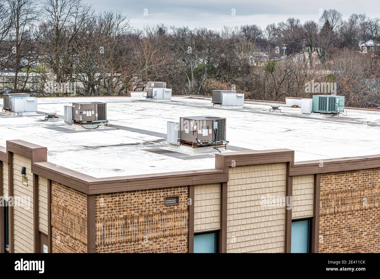 Horizontal shot of rooftop air conditioning units on top of a medical ...
