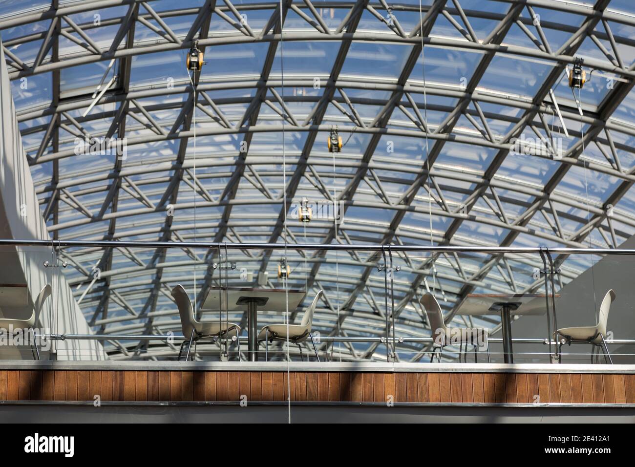 Modern cafe under the dome of glass and metal. Modern design and ...