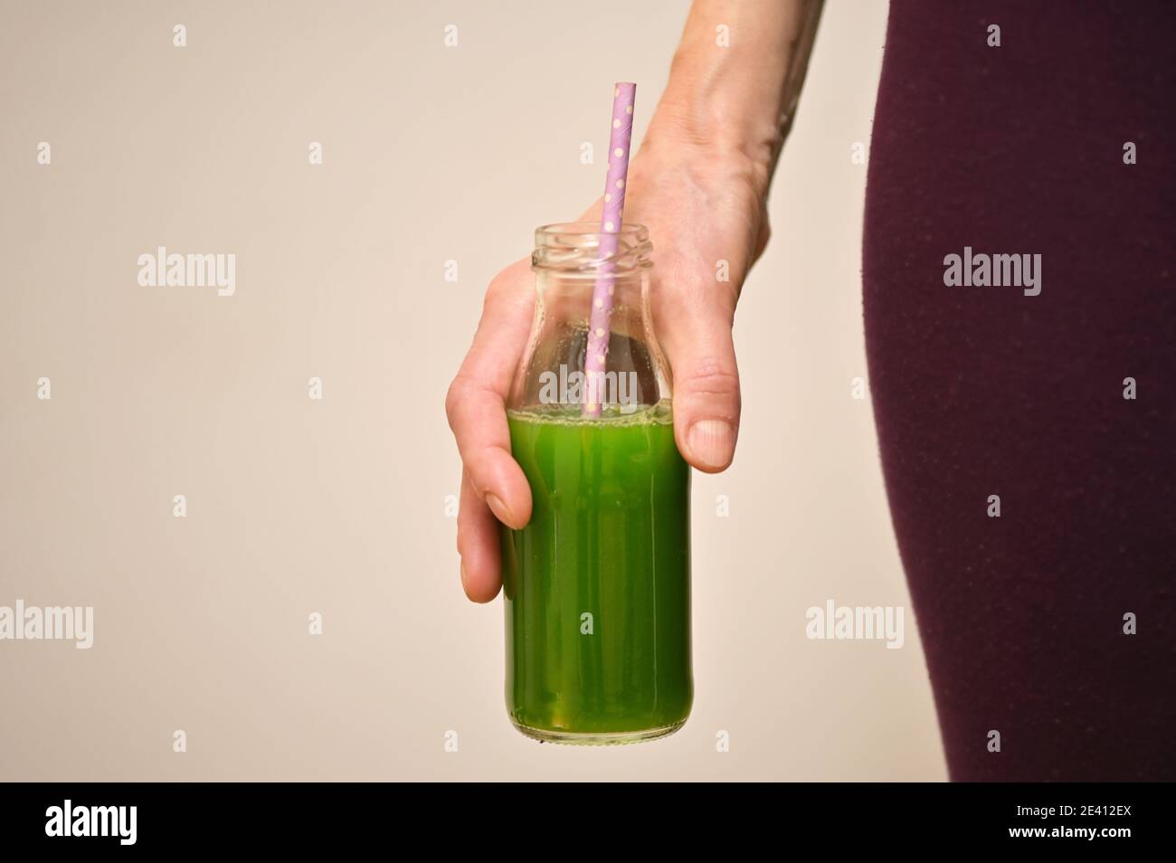 Details of Woman hand drinking healthy green drink after training Stock ...