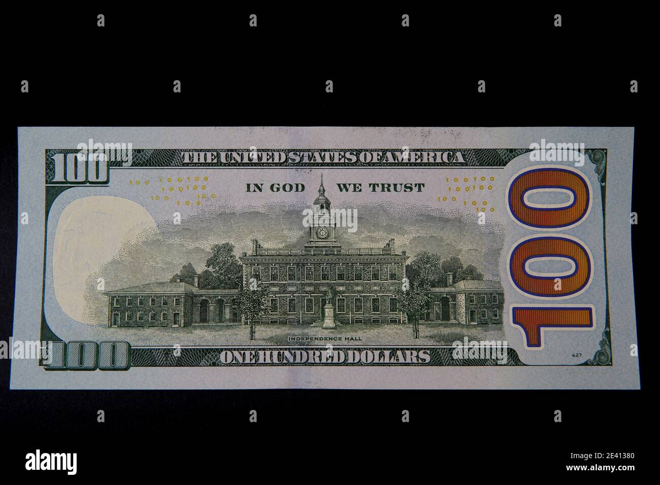 Flat lay of a 100 US banknote on a black surface Stock Photo - Alamy