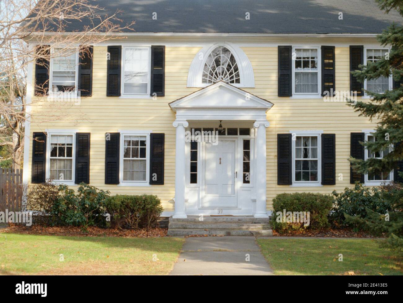 Late 18th/early 19th c. House, painted yellow elaborate window above ...