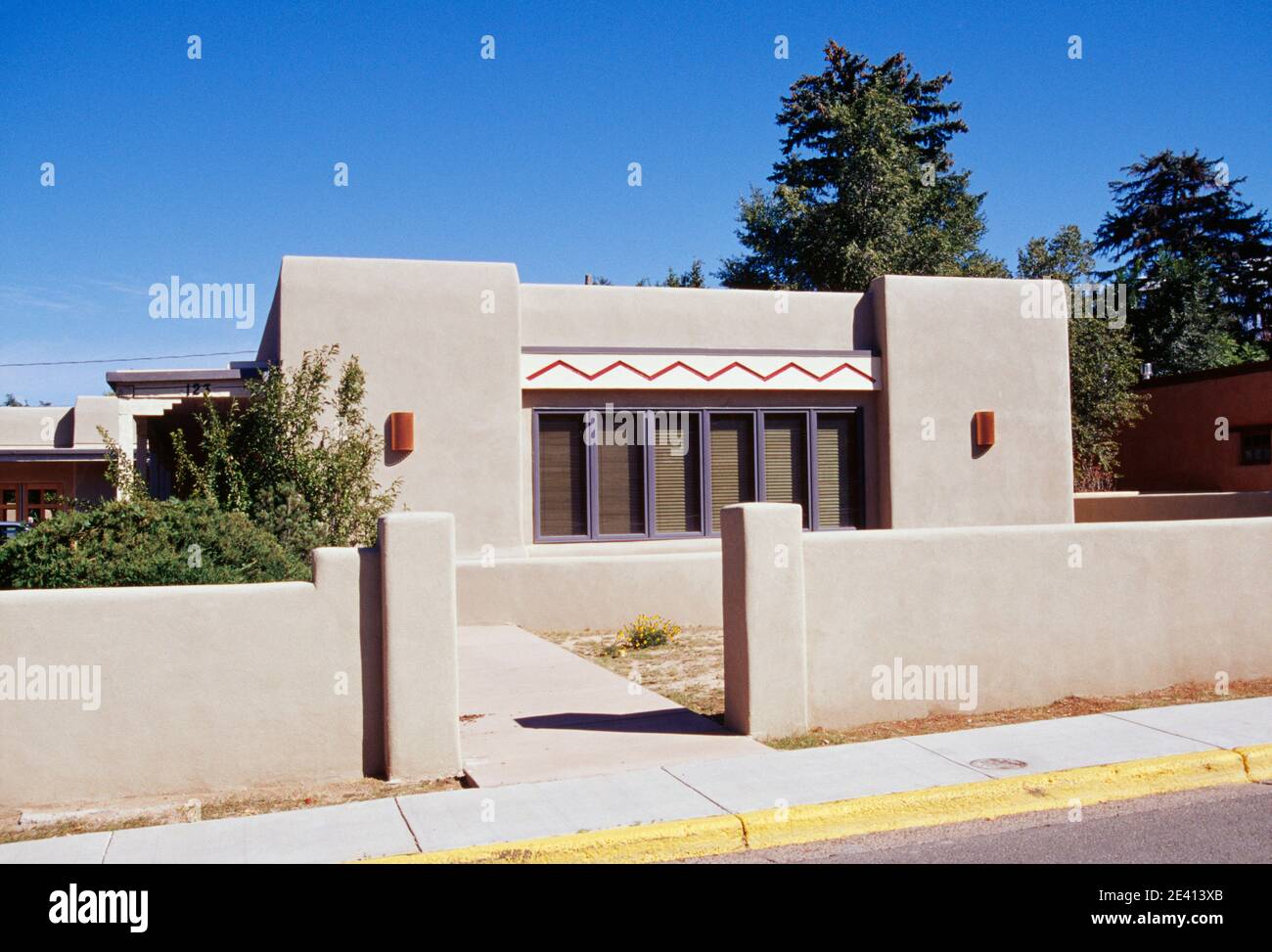 Single storey house in vernacular, adobe beige render/ stucco with bold ...